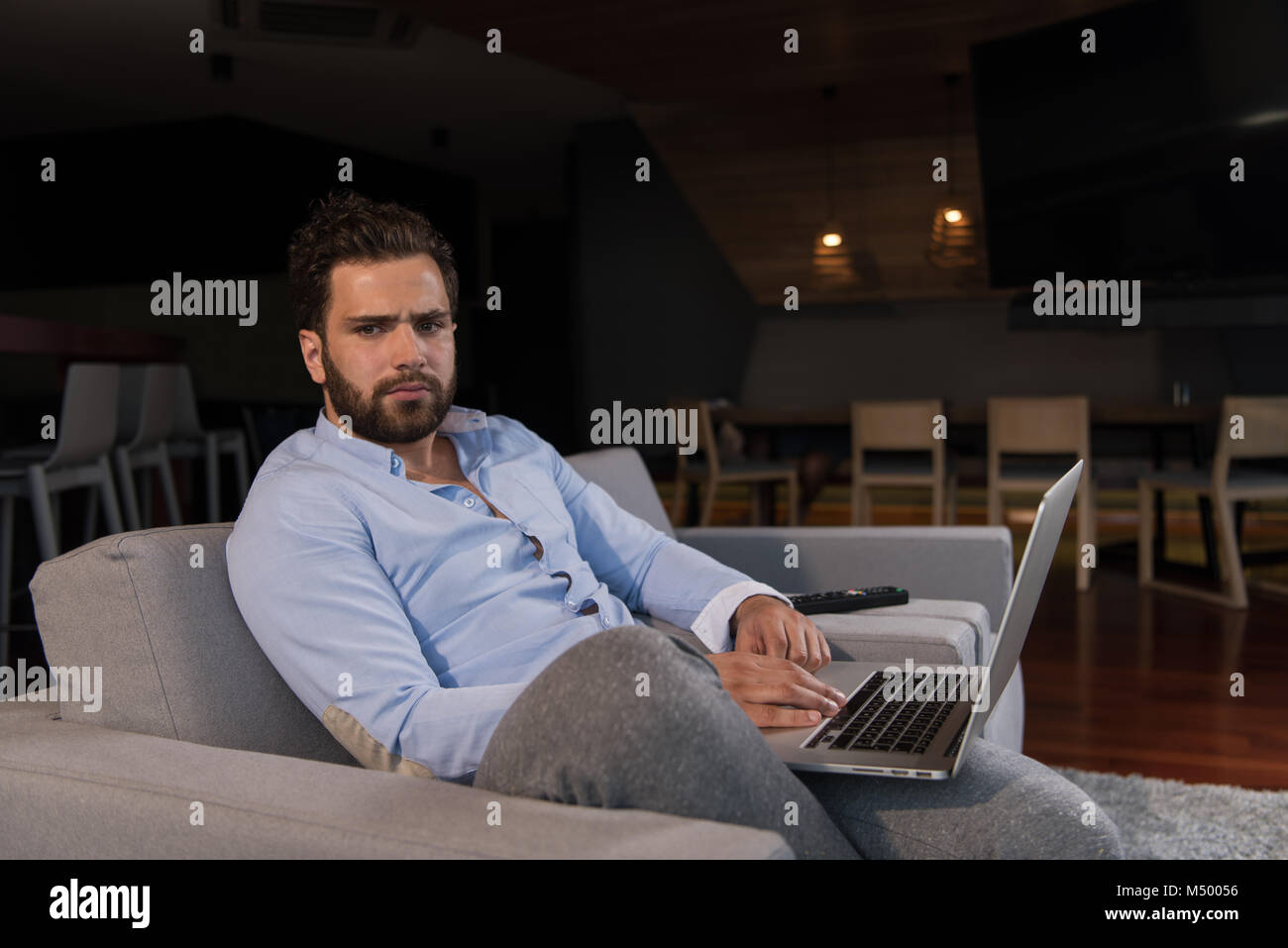 technology, home and lifestyle concept of man working from home using ...