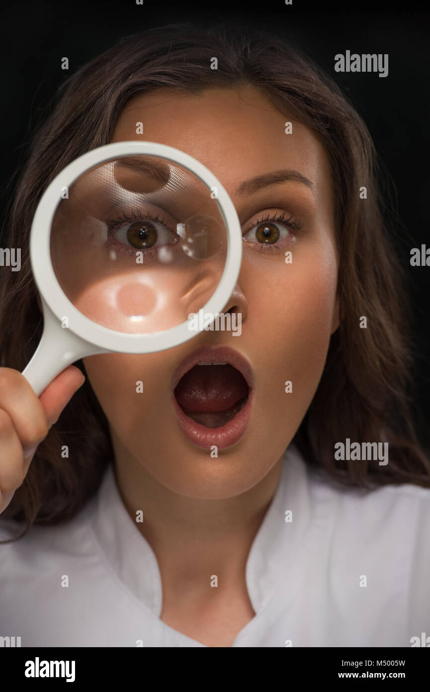 Doctor Looking Through Magnifying Glass Stock Photo - Alamy