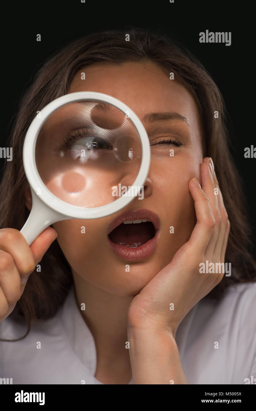 Doctor Looking Through Magnifying Glass Stock Photo - Alamy