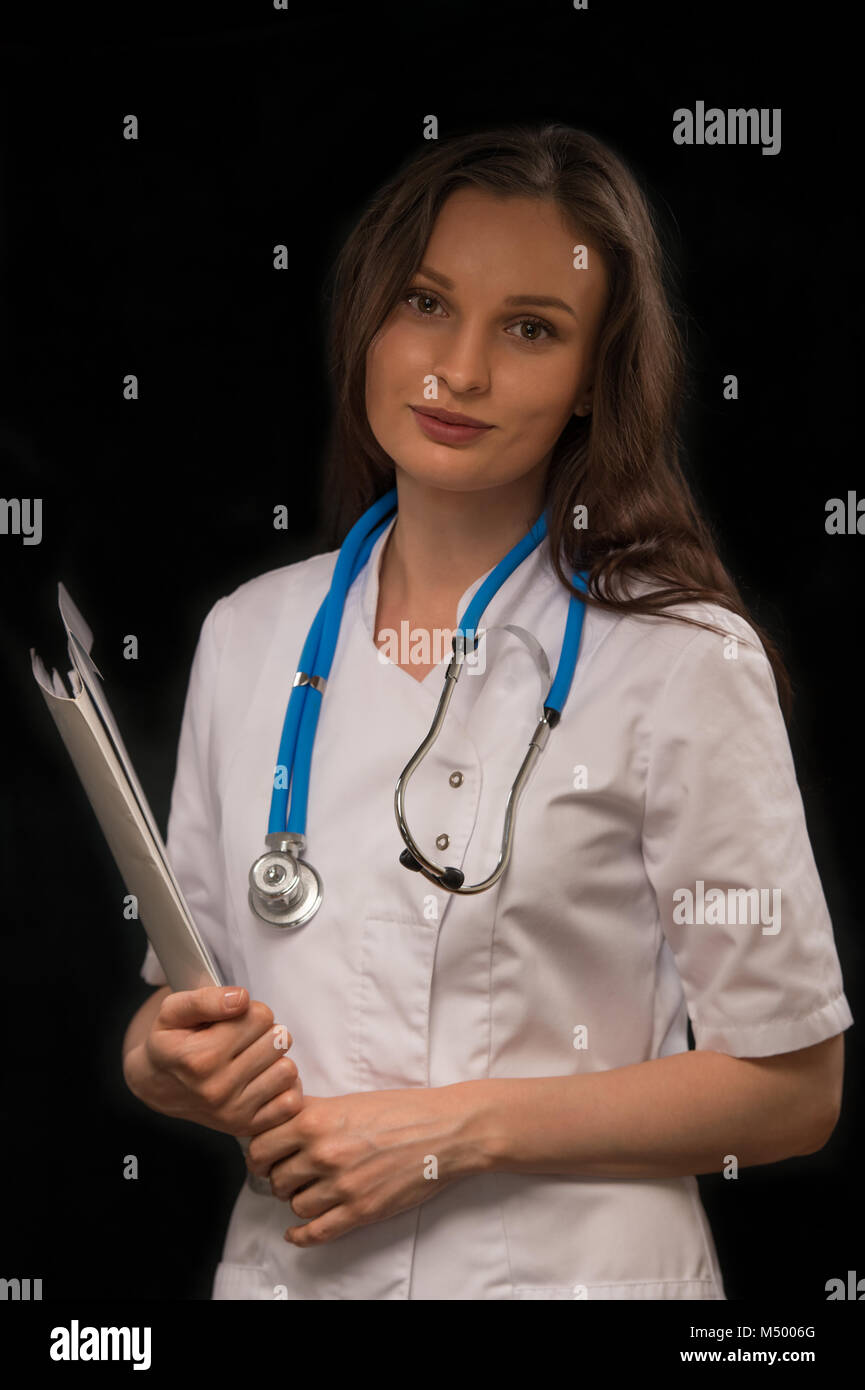 Female doctor reading medical record Stock Photo - Alamy Female doctor reading medical record Stock Photo - Alamy