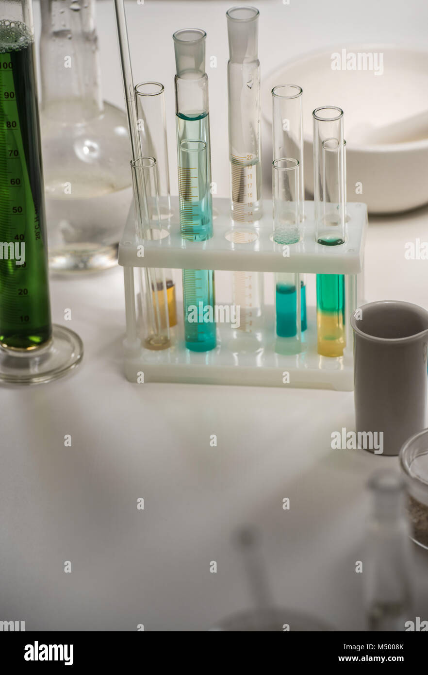 Group of laboratory flasks with liquid on table Stock Photo - Alamy