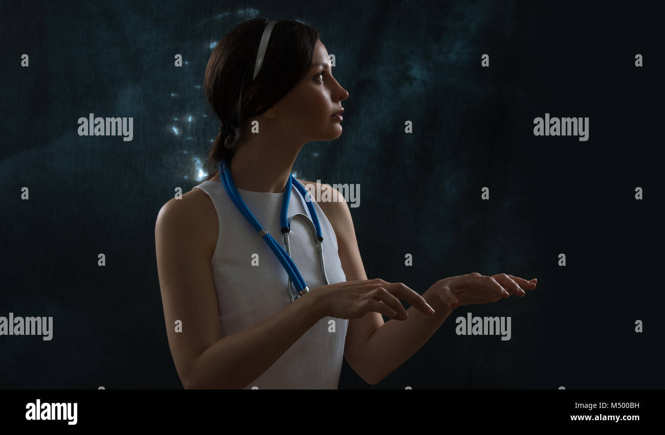 Doctor wearing futuristic clothes working with virtual screen. Space ...