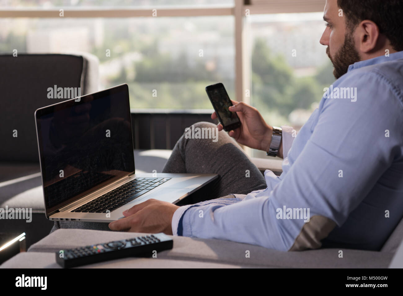 technology, home and lifestyle concept of man working from home using ...