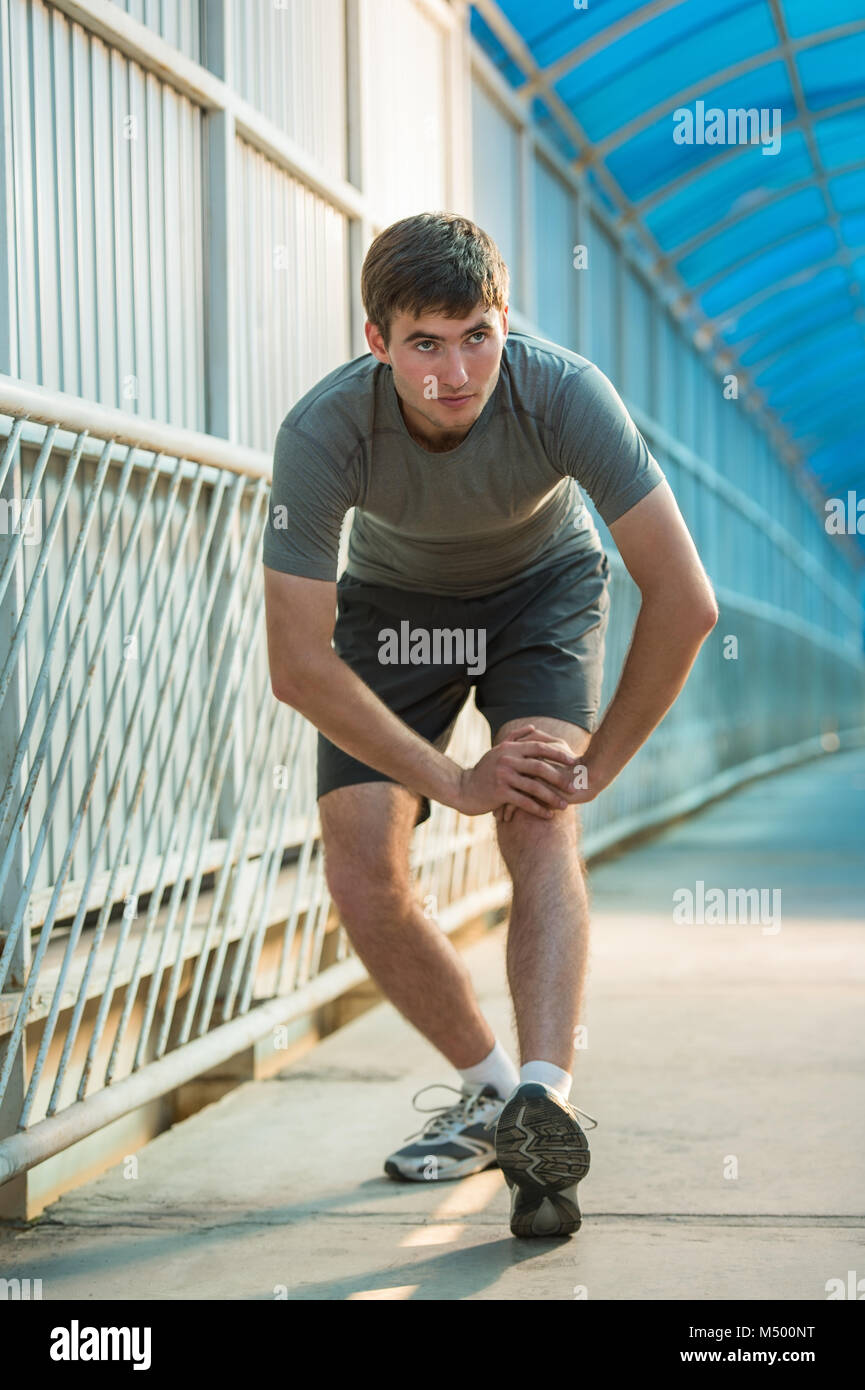 Man stretching outdoors in city Stock Photo - Alamy