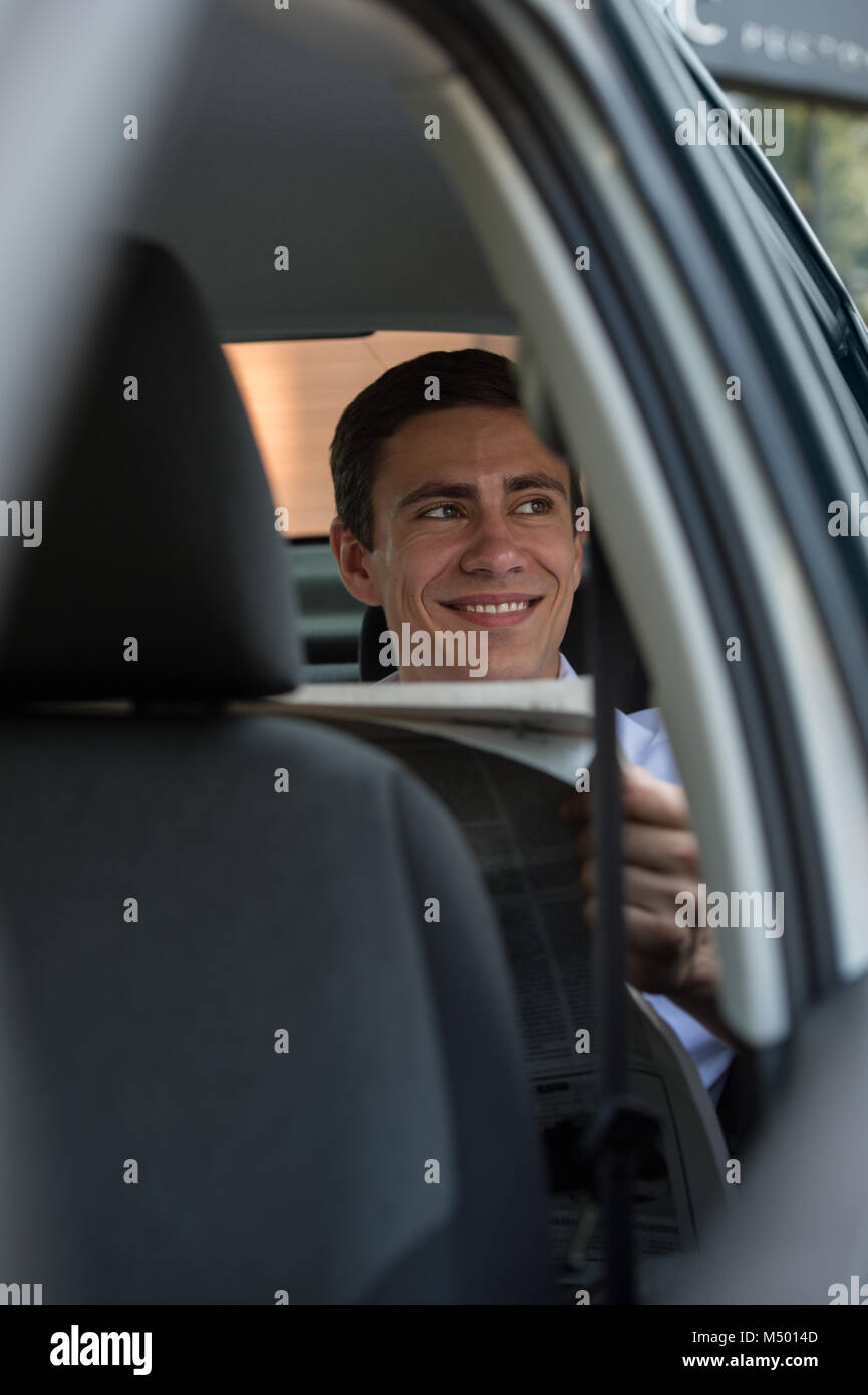 Taxi driver reading newspaper hi-res stock photography and images - Alamy
