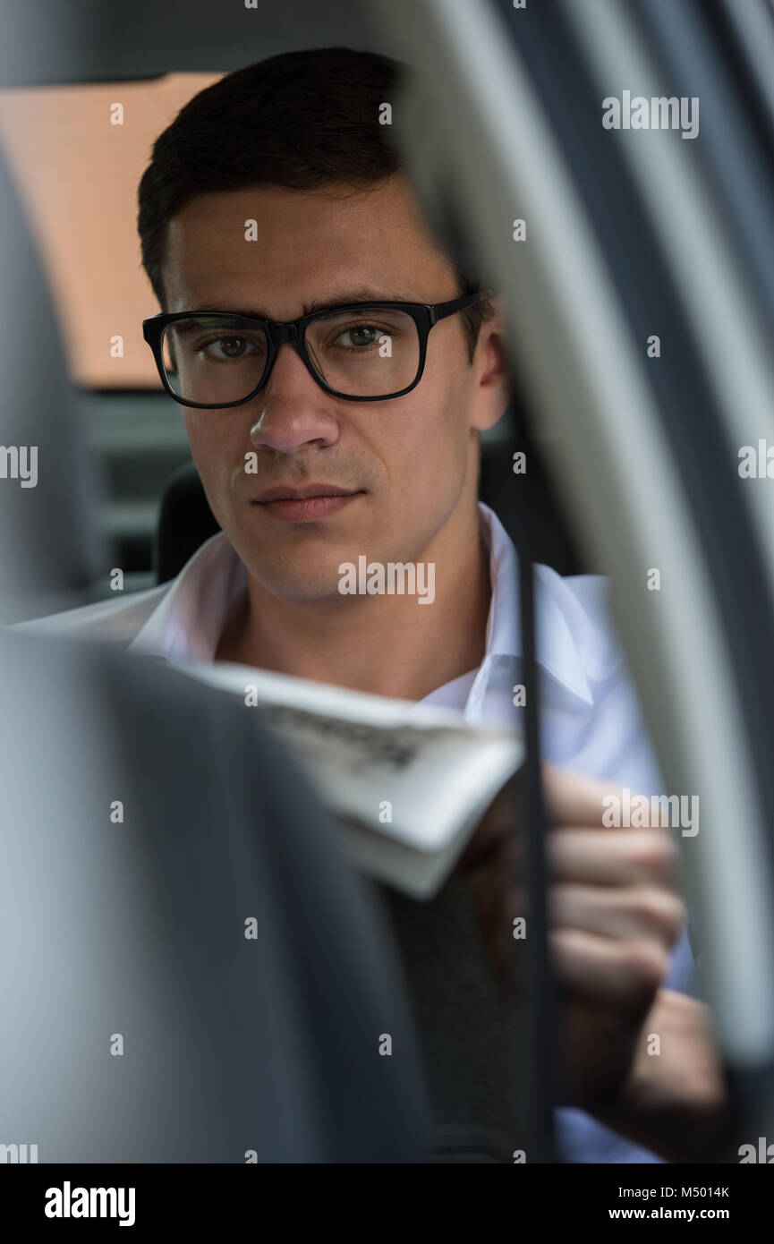 Taxi driver reading newspaper hi-res stock photography and images - Alamy