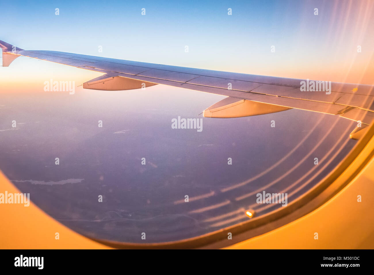 beautiful sunset view from an airplane over land Stock Photo - Alamy