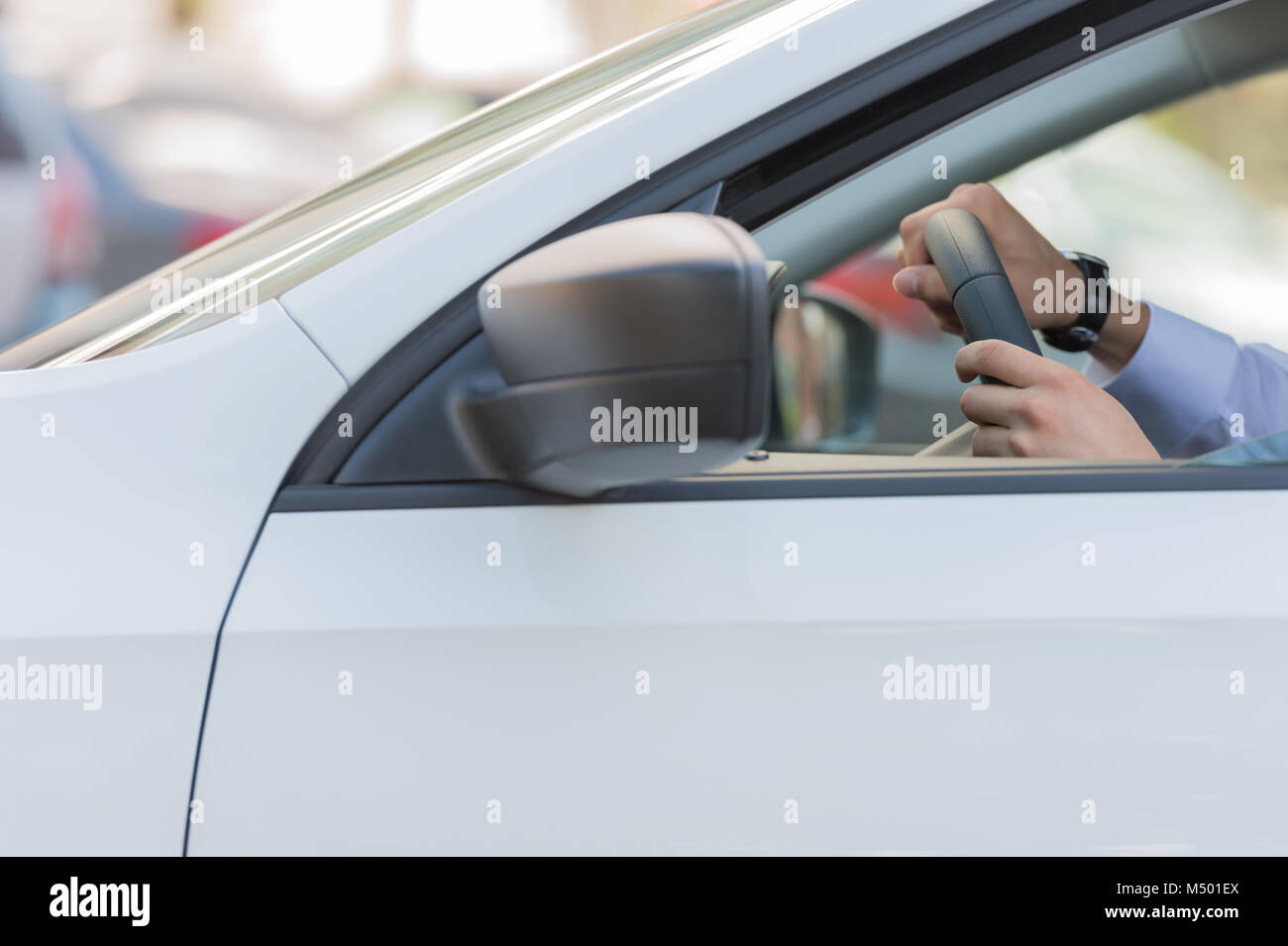 Unrecognizable man driving his car closeup Stock Photo - Alamy