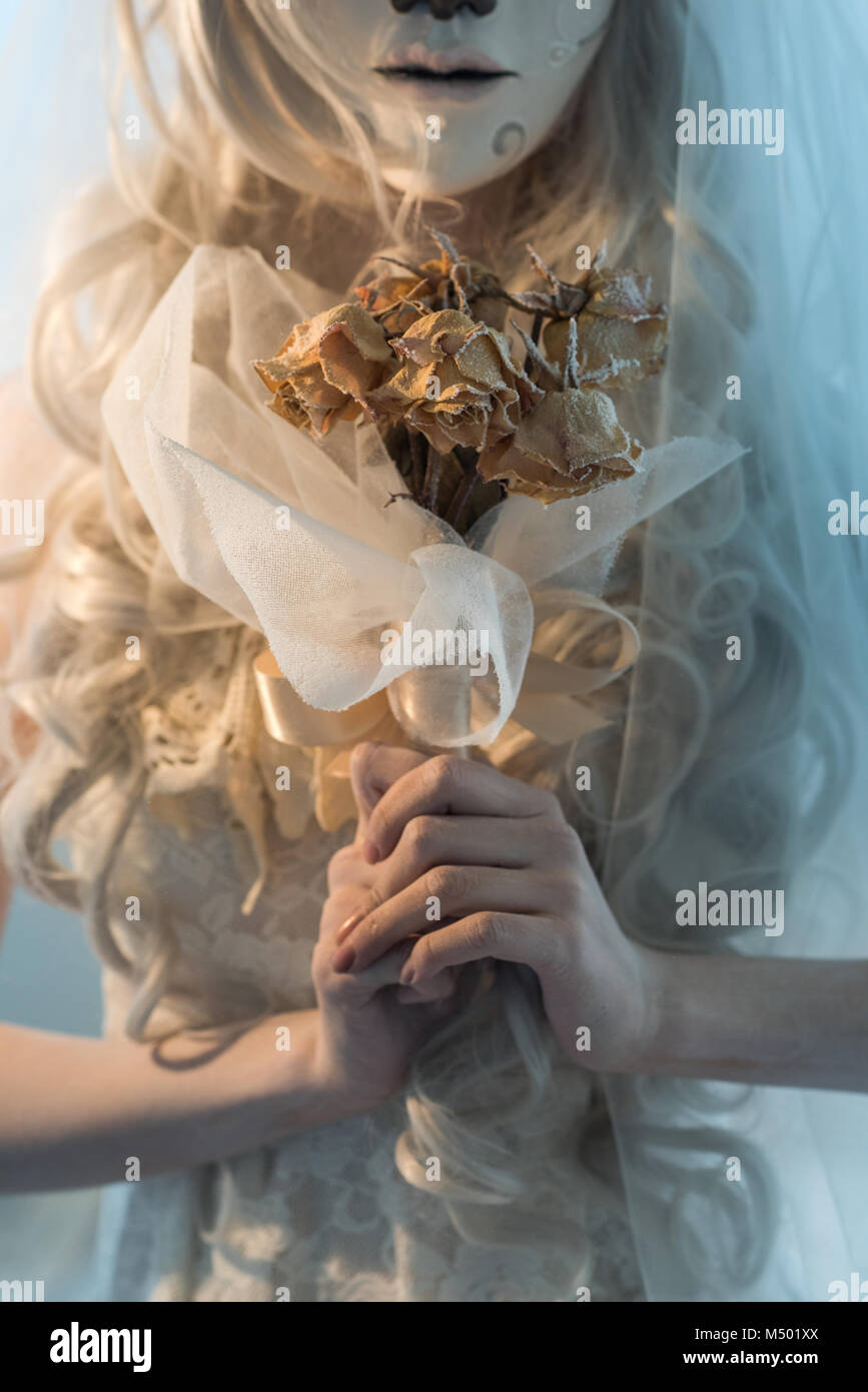 Halloween witch. Beautiful bride woman wearing santa muerte mask and ...