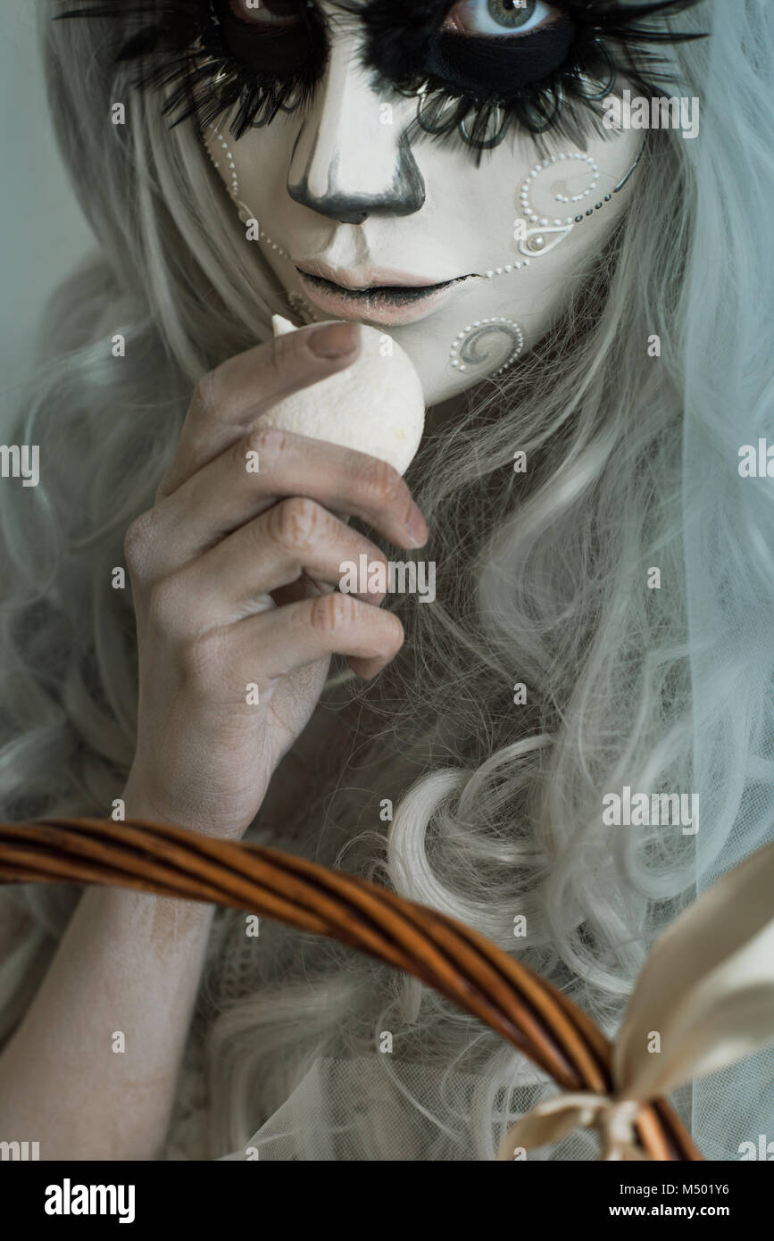 Halloween witch eating candy Stock Photo - Alamy