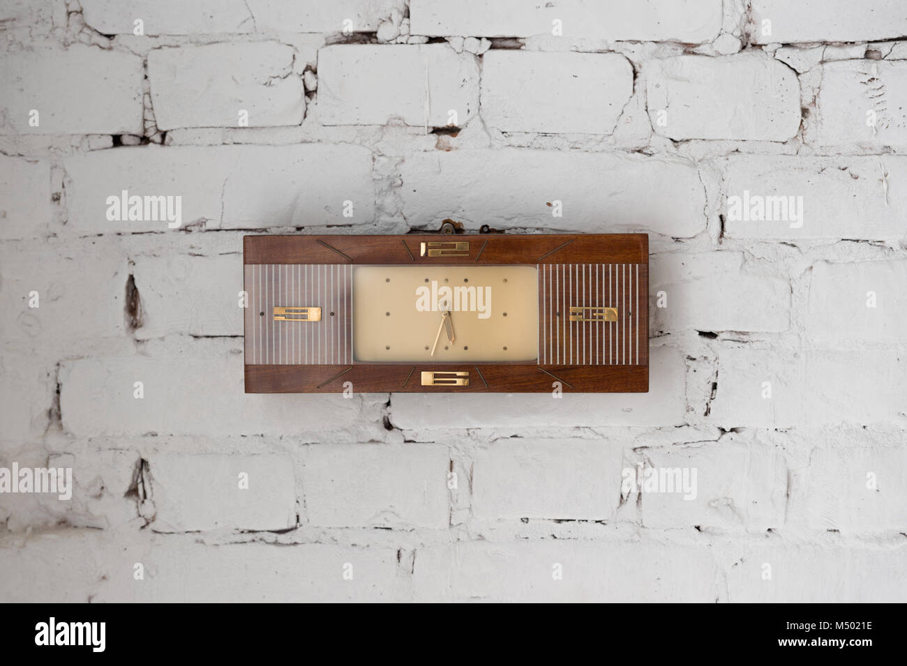 Vintage watches on white brick wall Stock Photo - Alamy