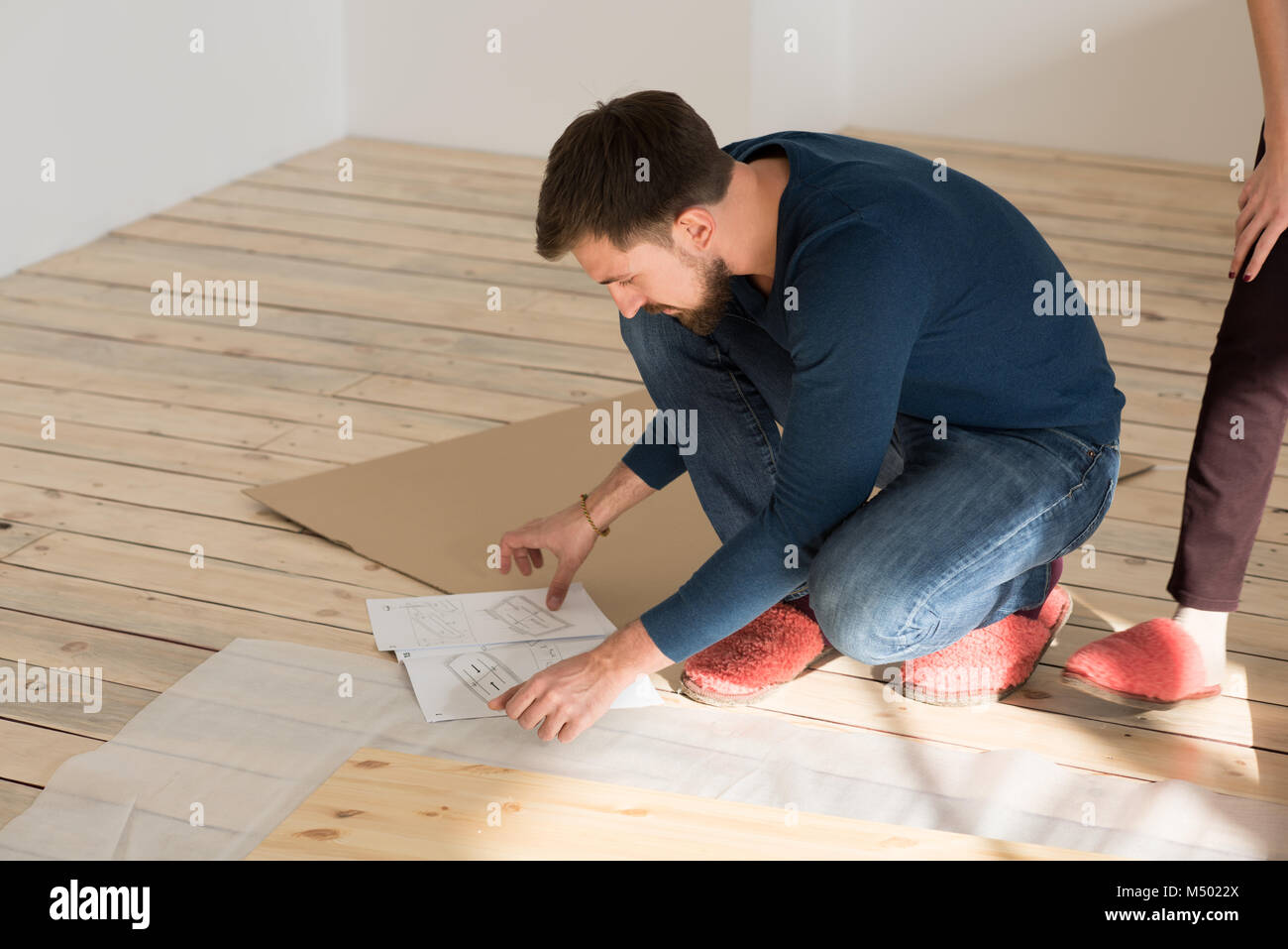 Man Putting Together Self Assembly Furniture In New Home Stock Photo ...