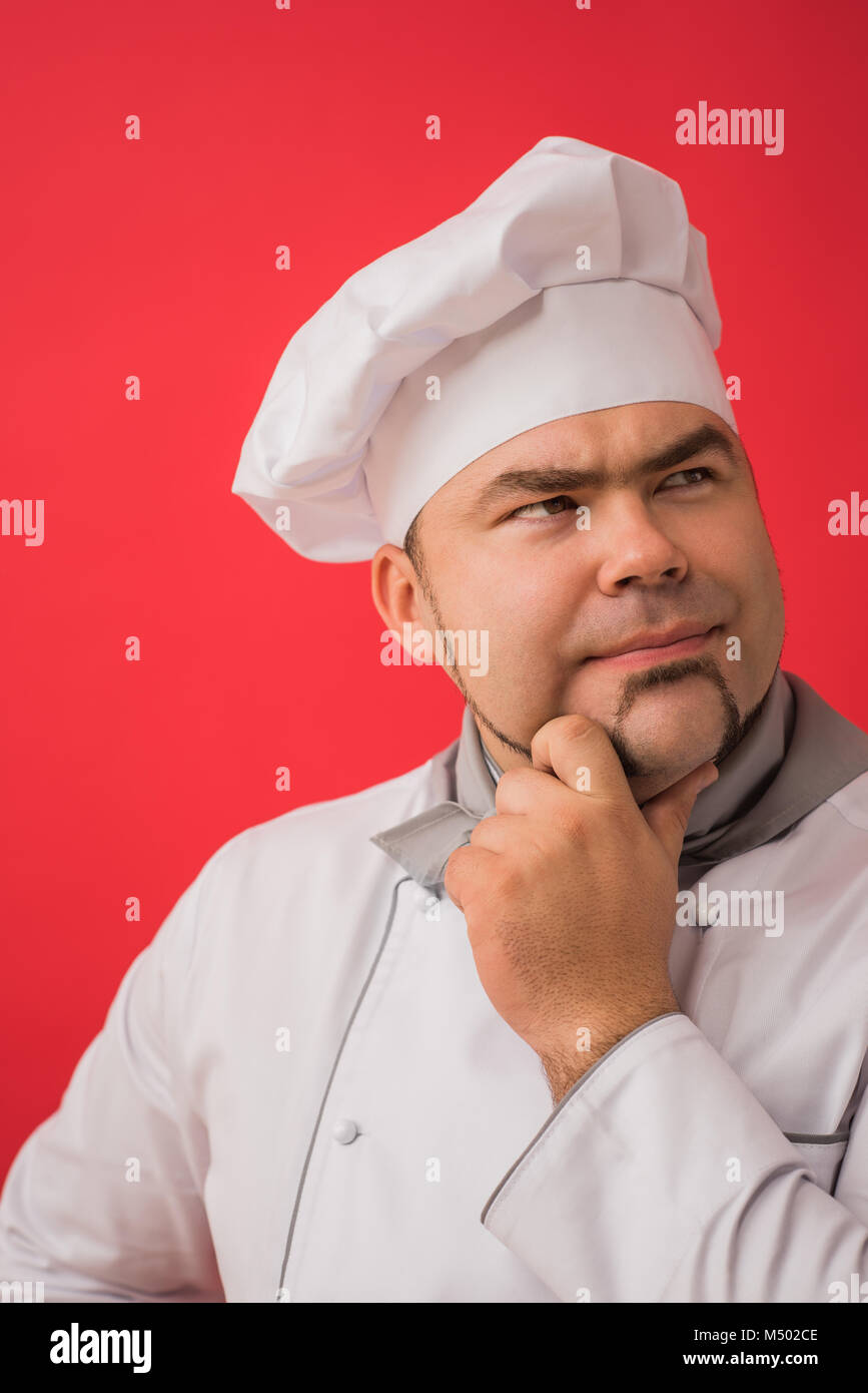 Portrait of caucasian man with chef uniform thinking Stock Photo - Alamy