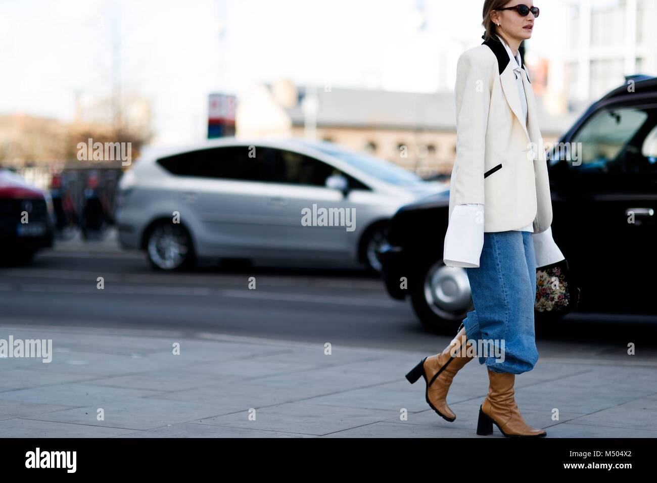 A chic showgoer walking outside the Toga runway show during London ...