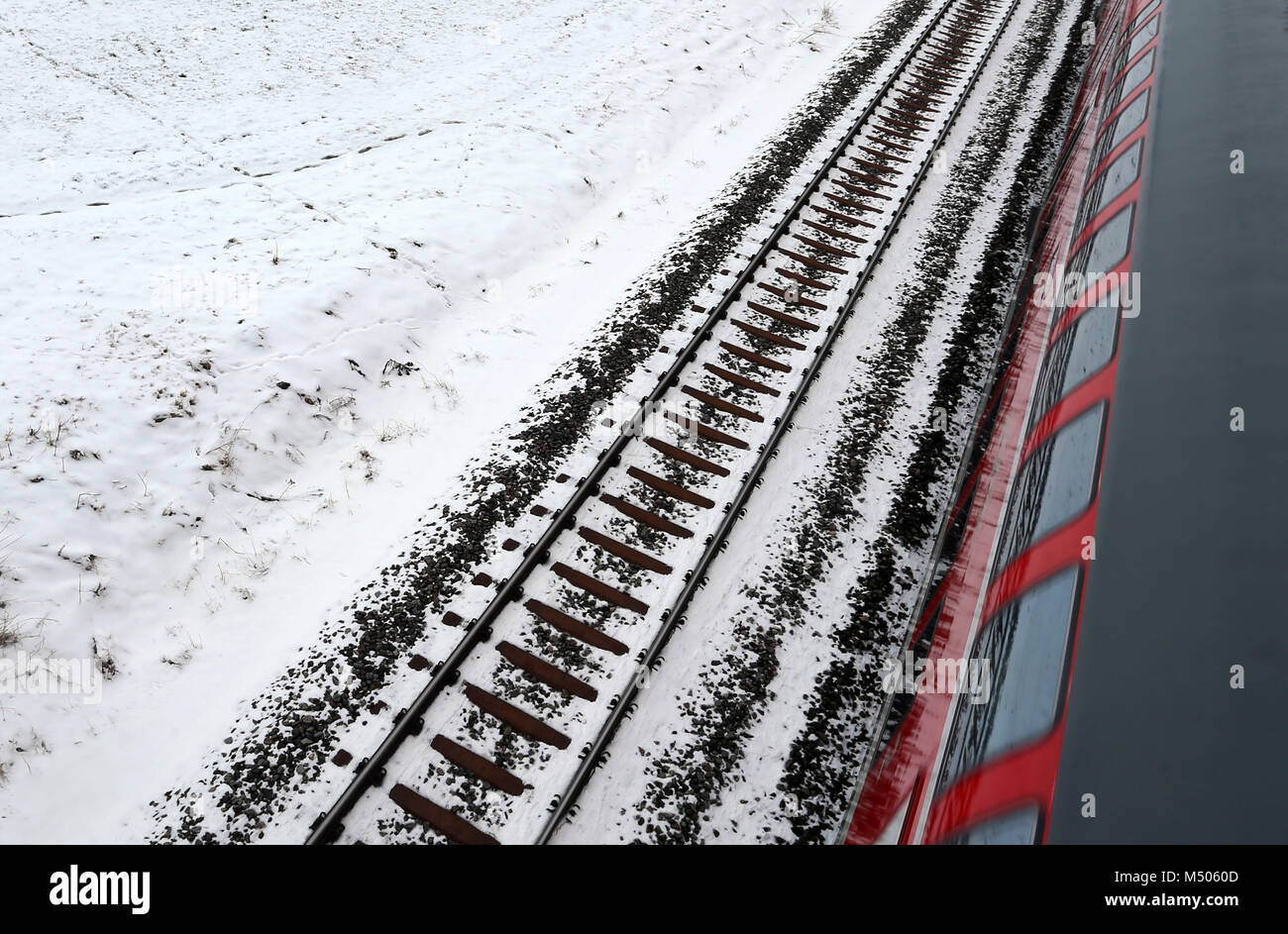 19 February 2018, Germany, Aitrang: Snow covers train tracks of the ...