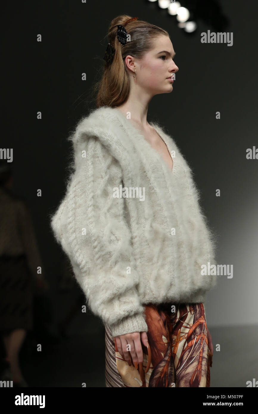 London, UK. 19th Feb, 2018. A model walk the runway at the Faustine ...