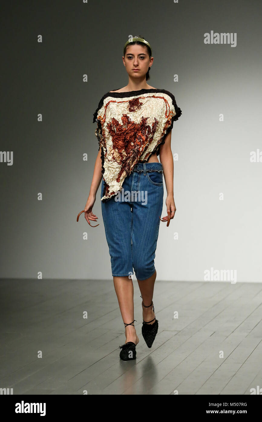 London, UK. 19th Feb, 2018. A model walk the runway at the Faustine ...