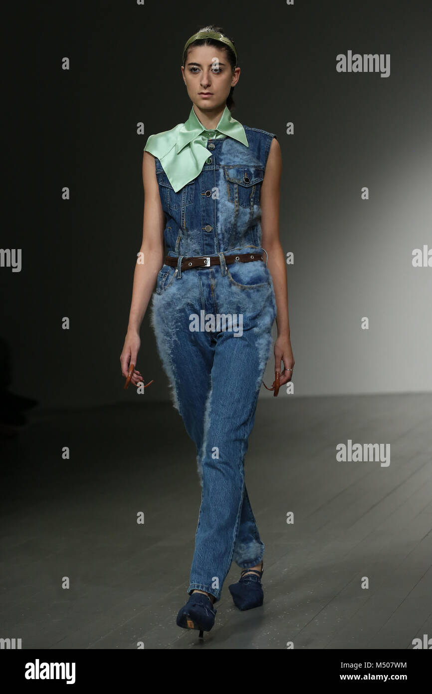 London, UK. 19th Feb, 2018. A model walk the runway at the Faustine ...