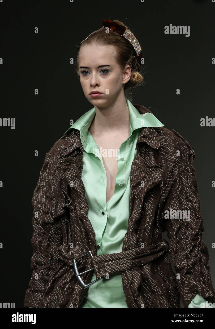 London, UK. 19th Feb, 2018. A model walk the runway at the Faustine ...