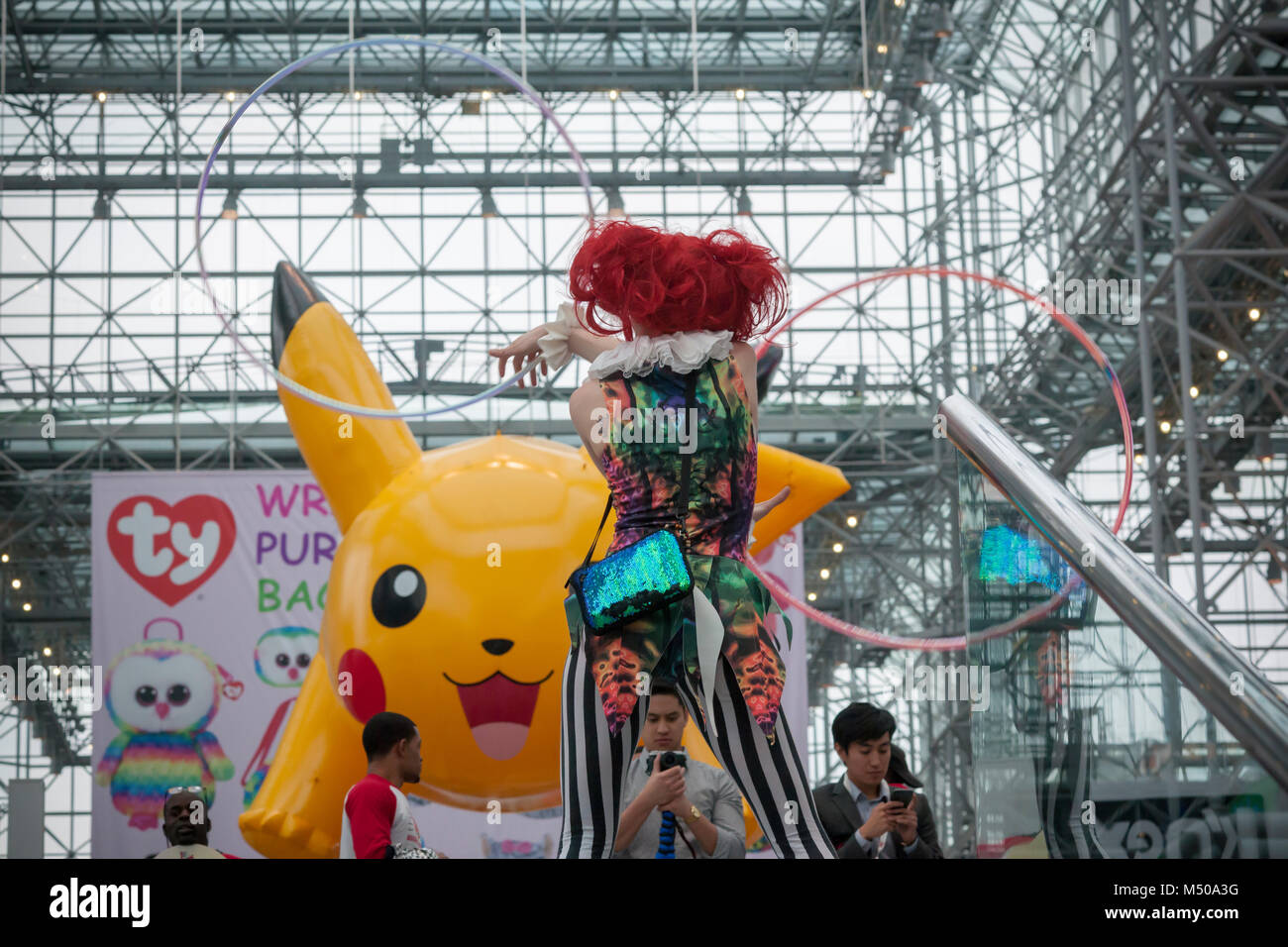 New York, USA. 19th February, 2018. A circus performer amuses the crowd ...
