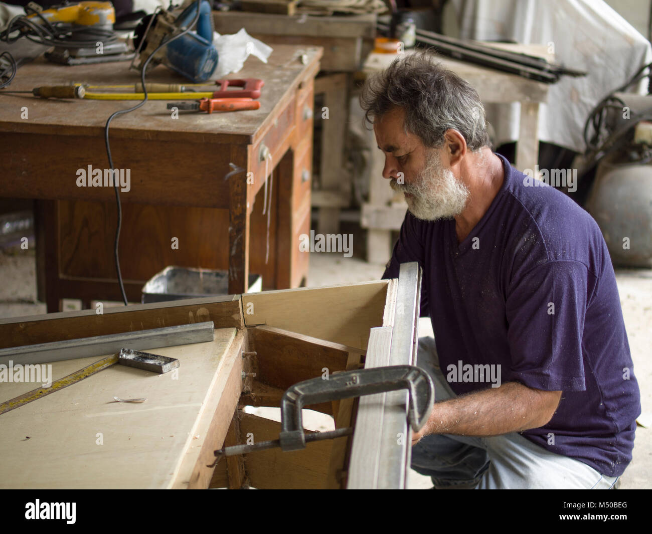 old man working with wood Stock Photo - Alamy