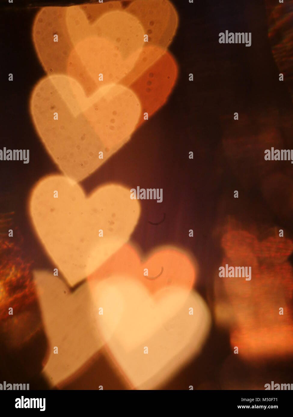 Golden color heart bokeh background hi-res stock photography and images ...