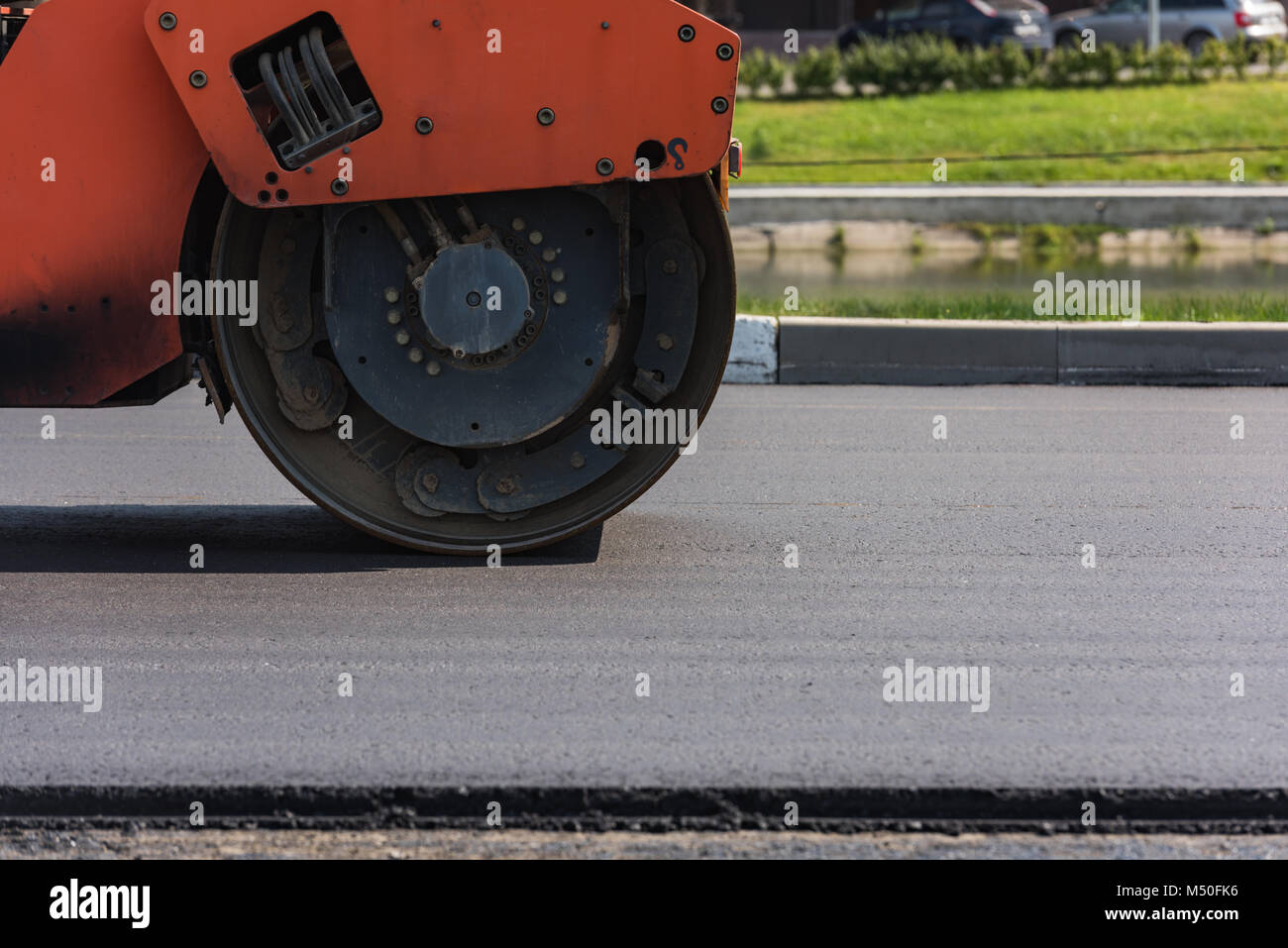 Laying new black asphalt hi-res stock photography and images - Alamy