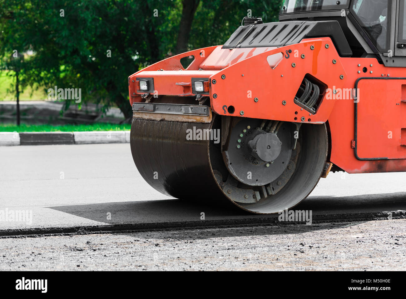 Tracked paver laying fresh asphalt hi-res stock photography and images ...
