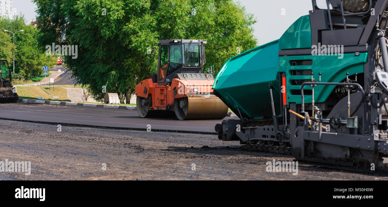New asphalt laying Stock Photo - Alamy