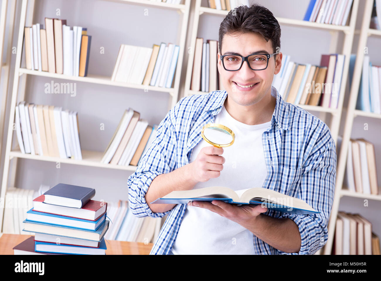 Young student with books preparing for exams Stock Photo - Alamy