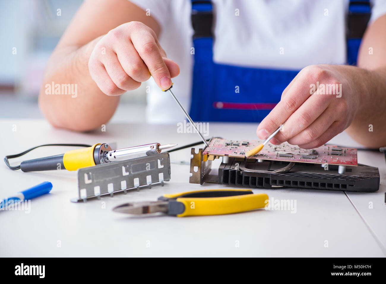 Computer repairman repairing desktop computer Stock Photo - Alamy