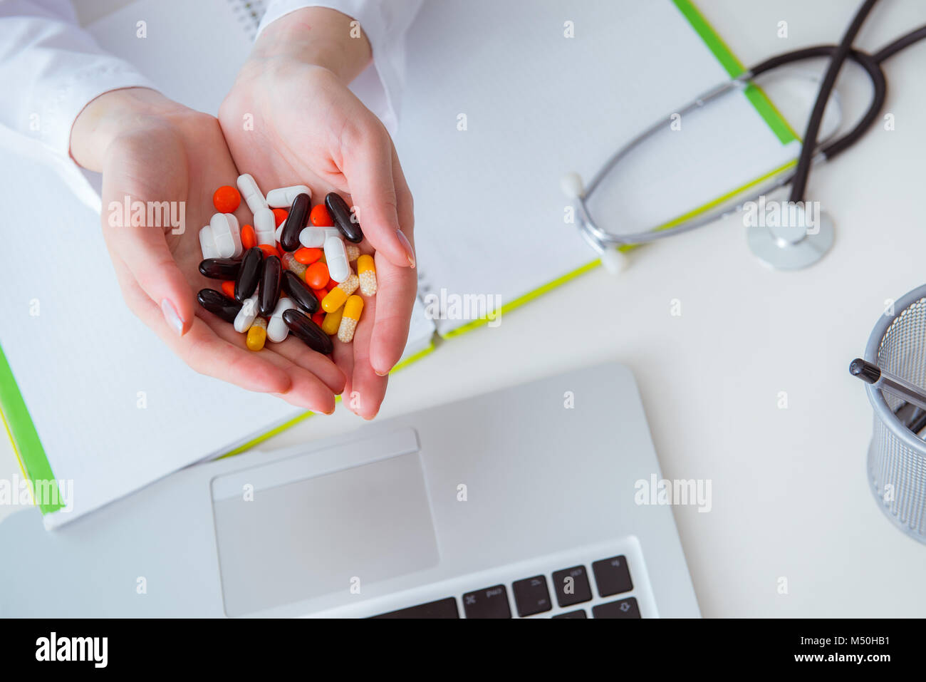 Medical concept with medicines and laptop computer Stock Photo - Alamy