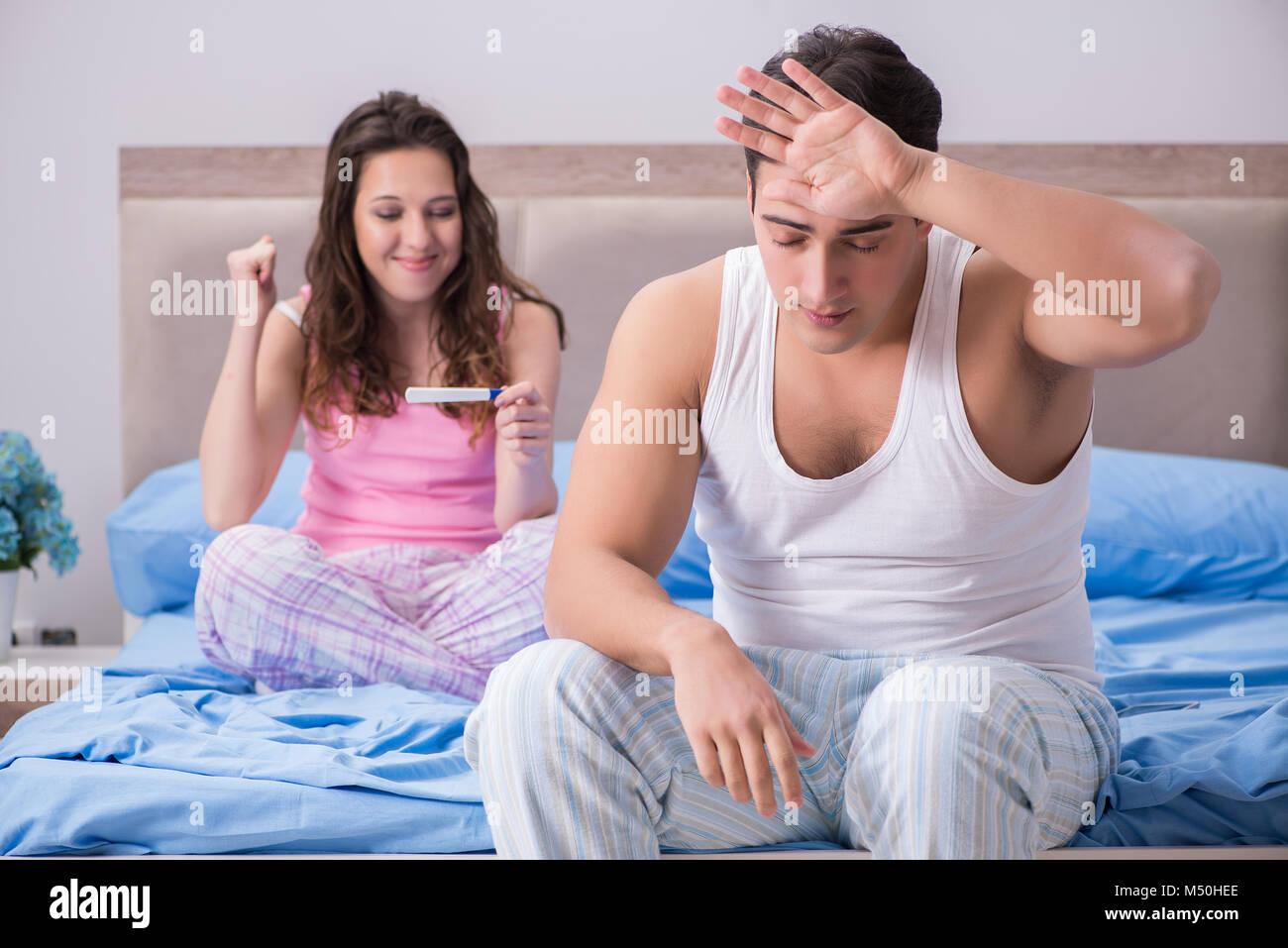 Young family with pregnancy test results Stock Photo - Alamy