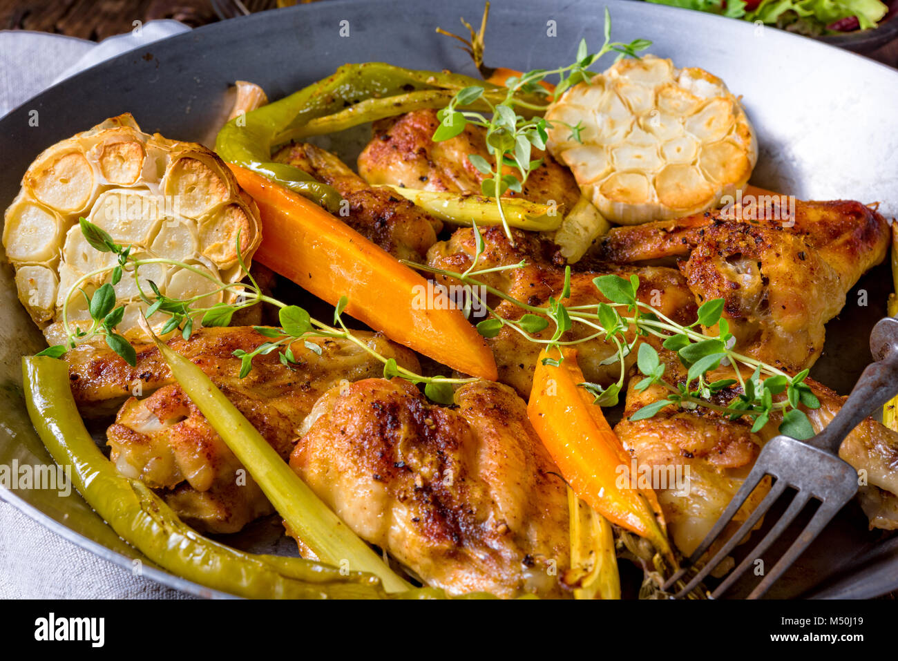 Grilled chicken wings with caramelized carrots Stock Photo - Alamy