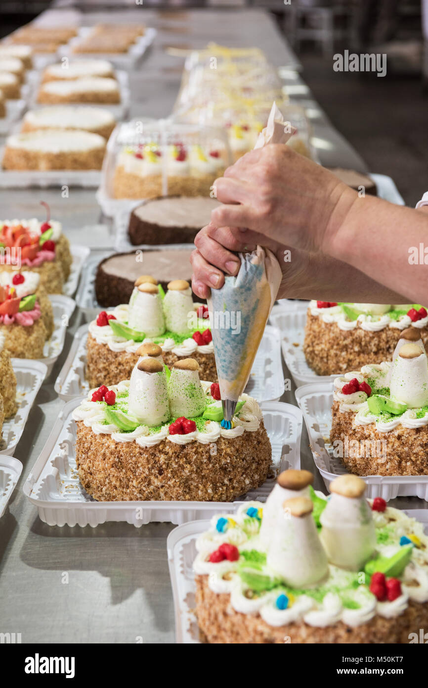 Manual cakes production Stock Photo - Alamy
