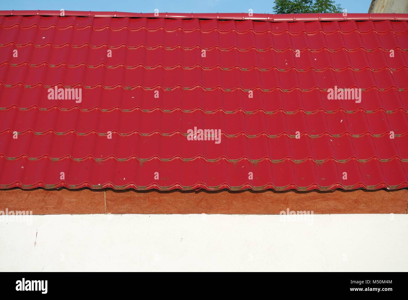Red sheet metal roof Stock Photo - Alamy