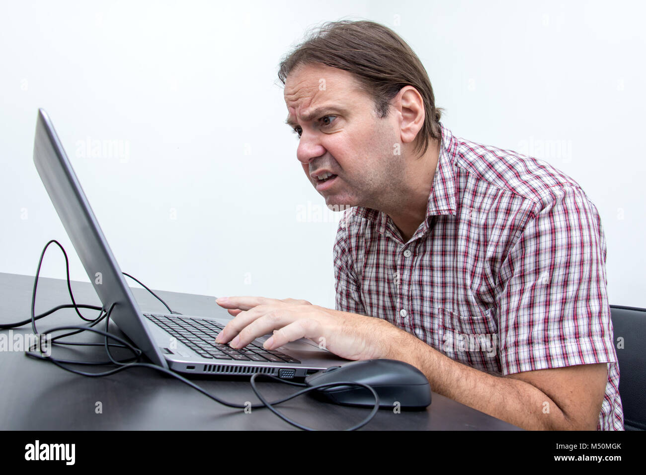 The confused unhappy user is looking at the computer screen. Surprised ...