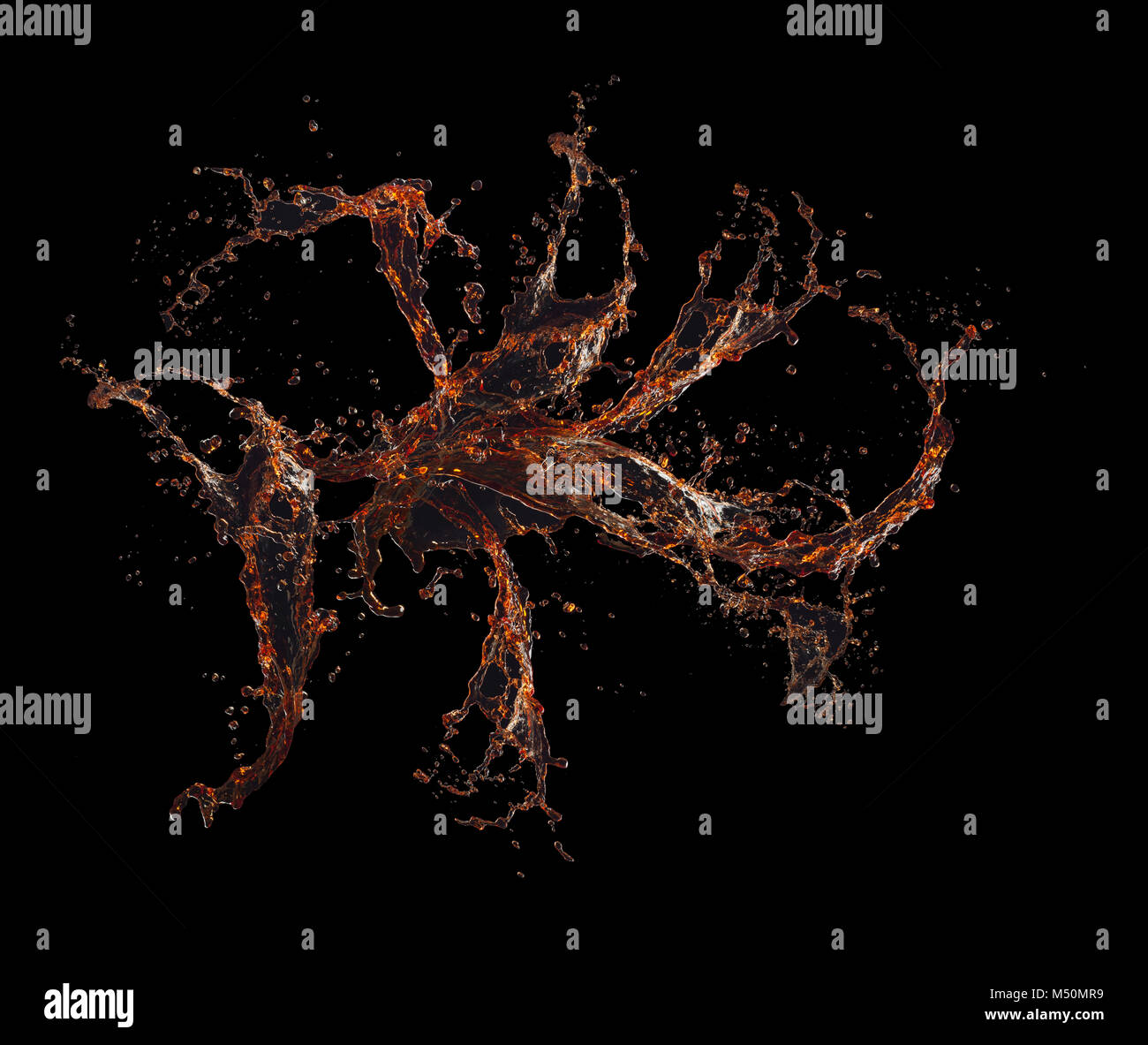 splash of ink isolated on black background. golden splash close-up ...