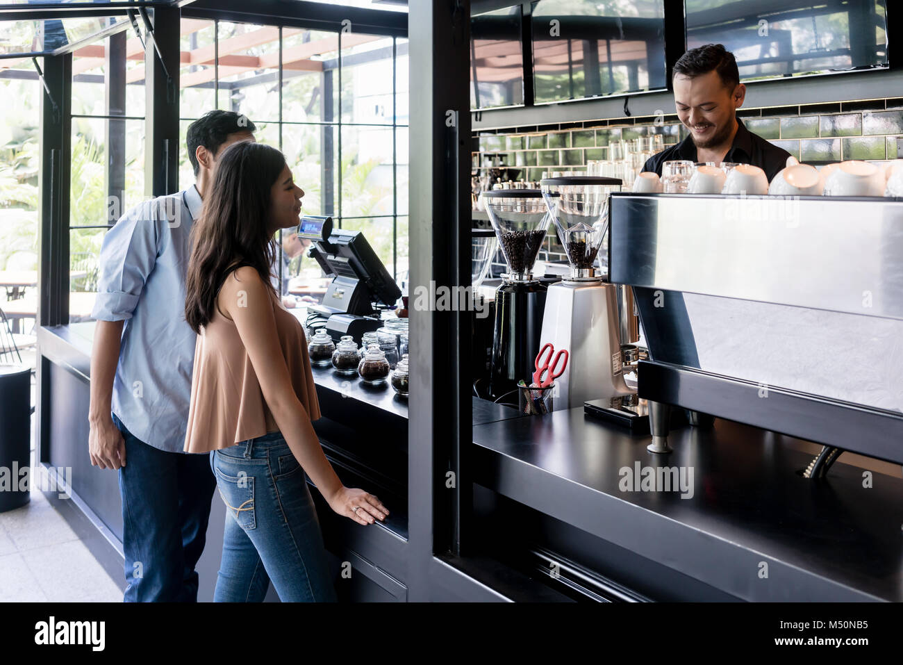 Young men at bar counter hi-res stock photography and images - Alamy