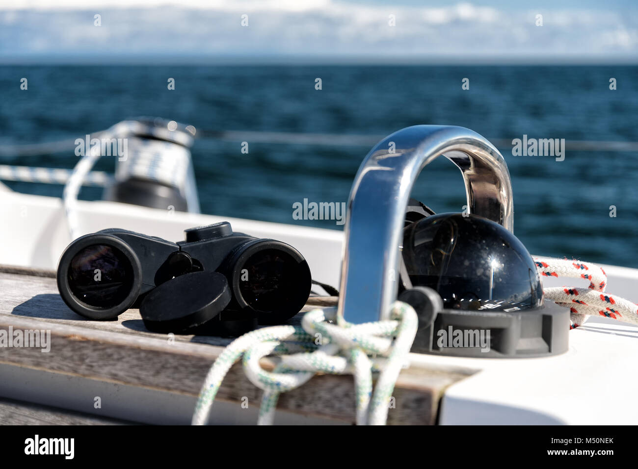 compass and binoculars on a sailing yacht Stock Photo - Alamy
