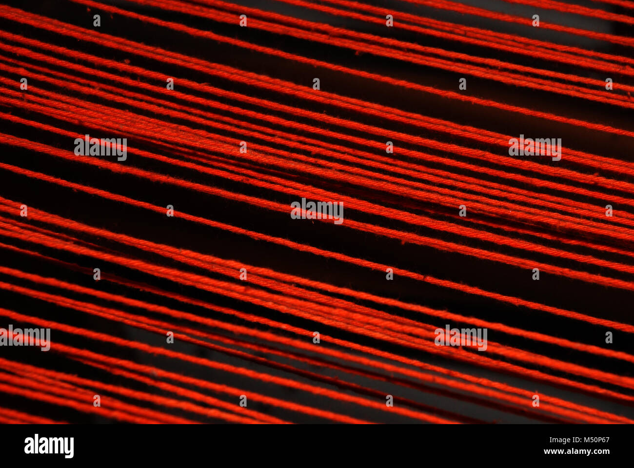 strained thic red threads Stock Photo - Alamy