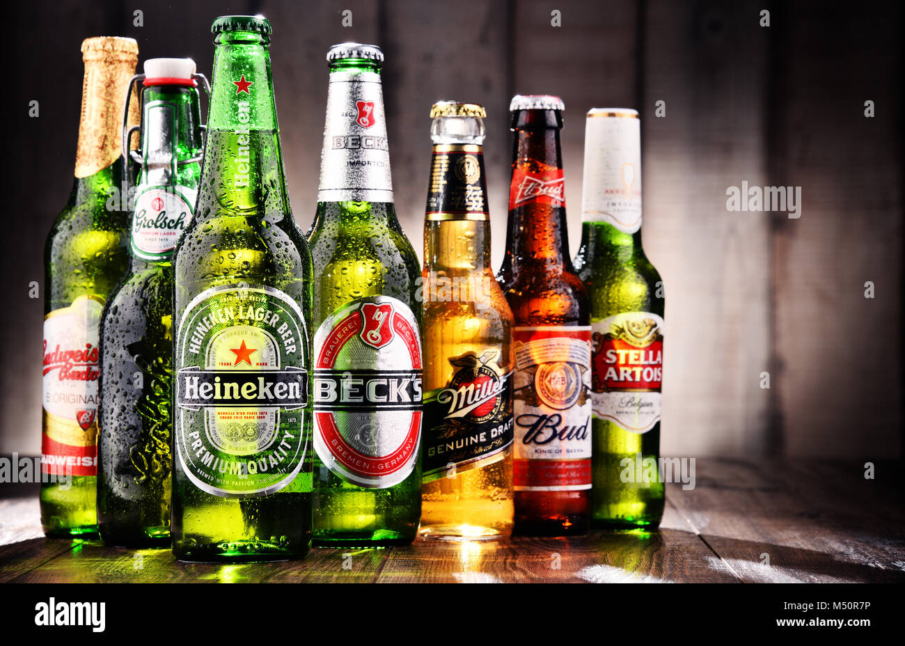 Bottles of assorted global beer brands Stock Photo - Alamy