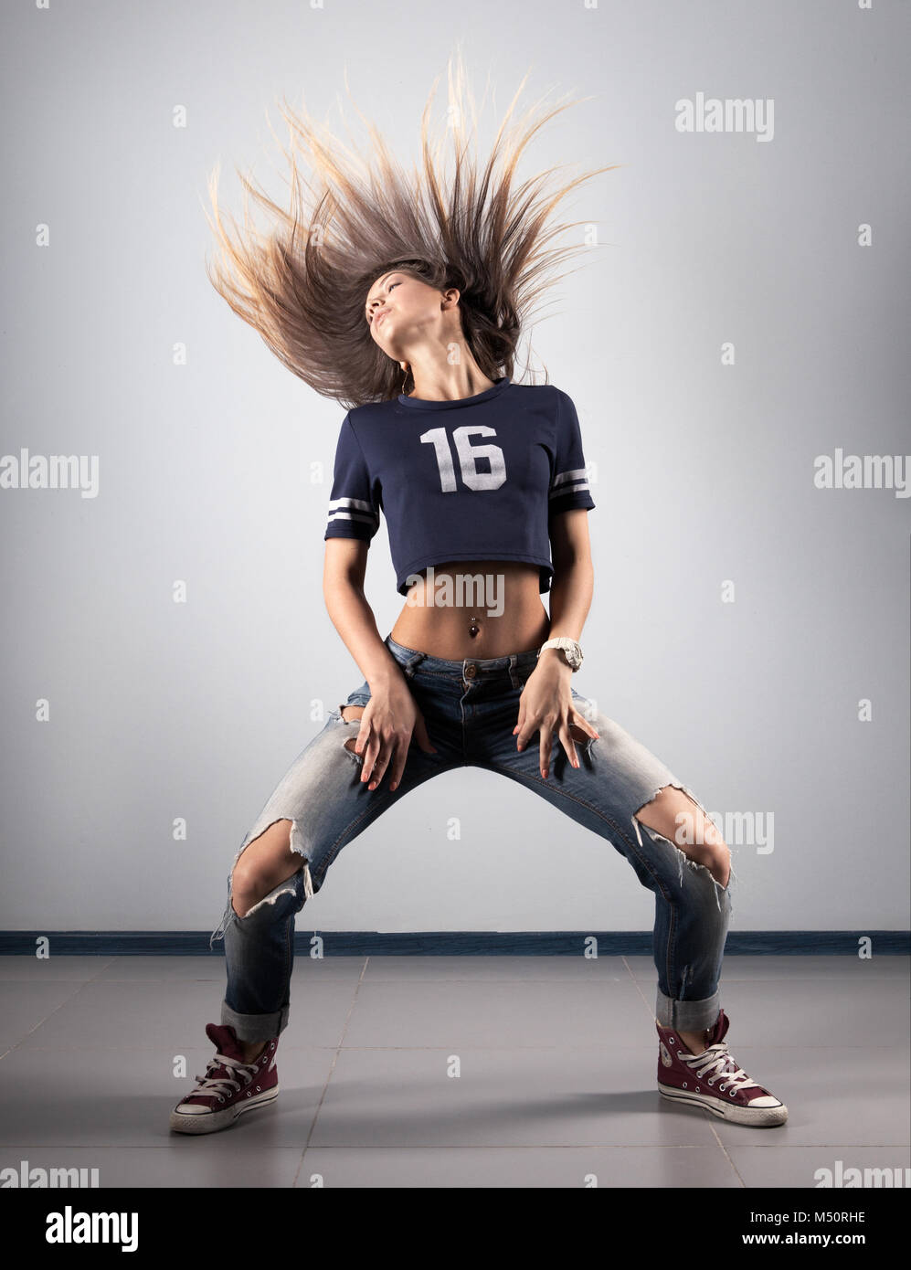 modern young beautiful dancer posing on a studio background Stock Photo ...