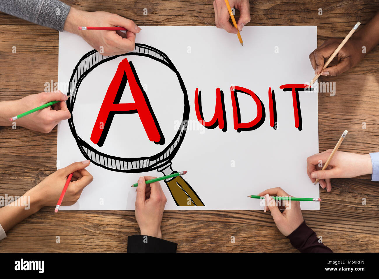 People Drawing Audit And Fraud Investigation Concept On Paper Stock ...