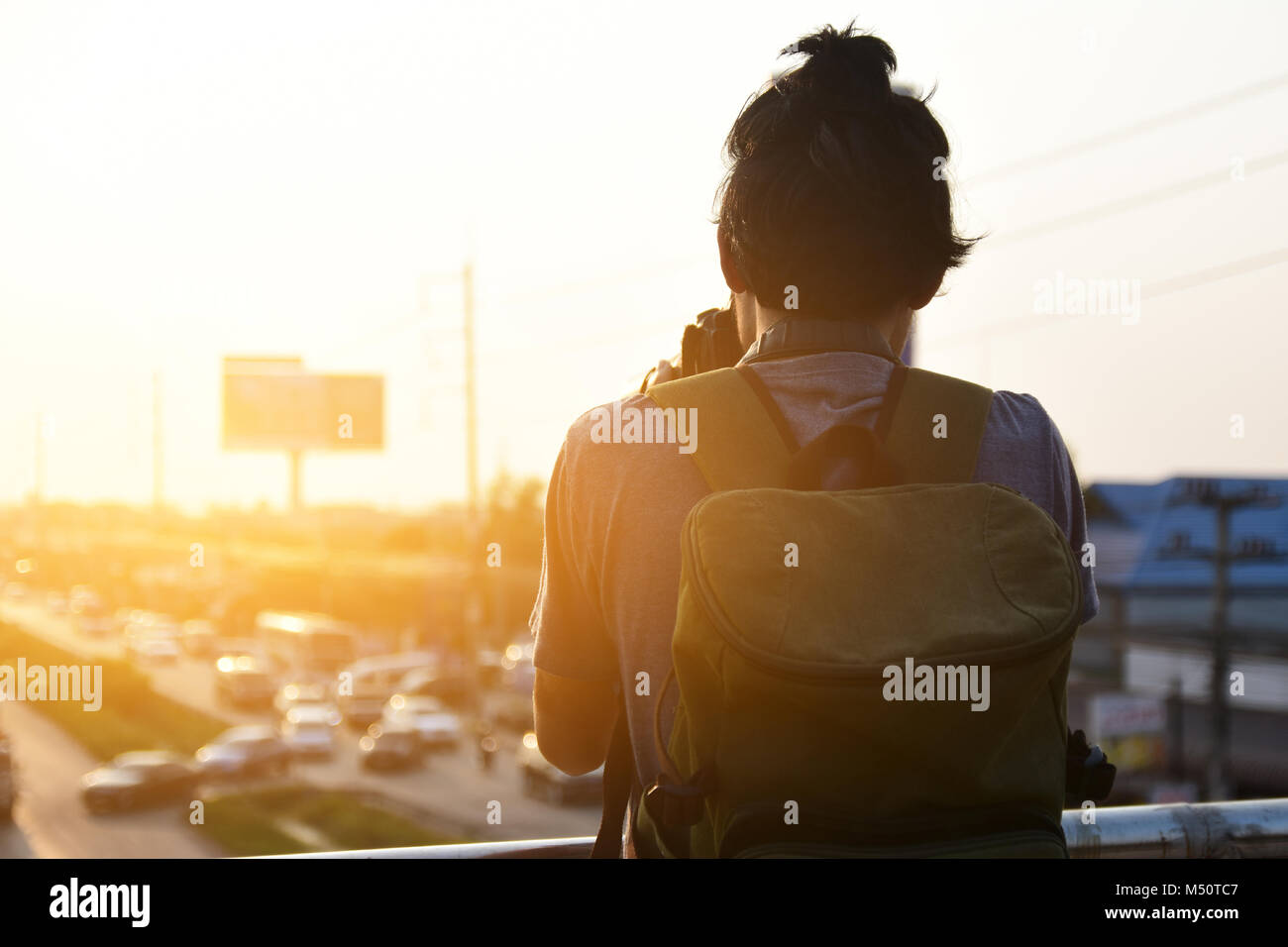 silhouette man and Back Light Techniques for photography,Man holding ...