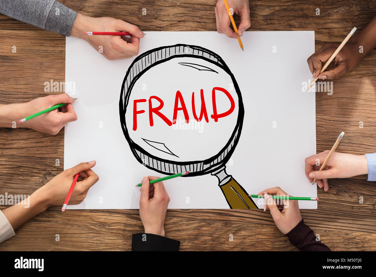 People Drawing Fraud Investigation And Audit Concept In Notepad Stock ...