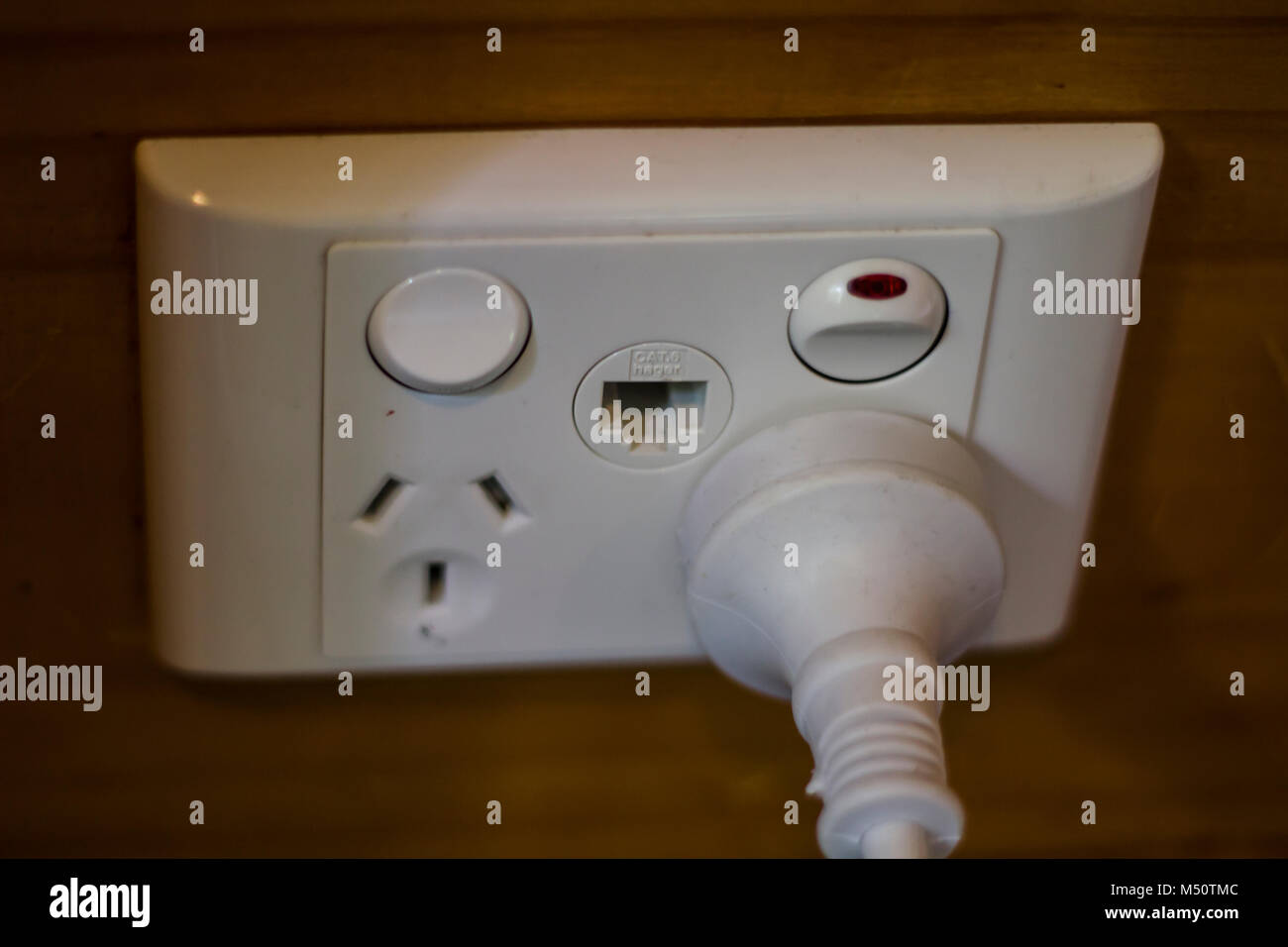 Plug inserted in Electrical socket Stock Photo - Alamy