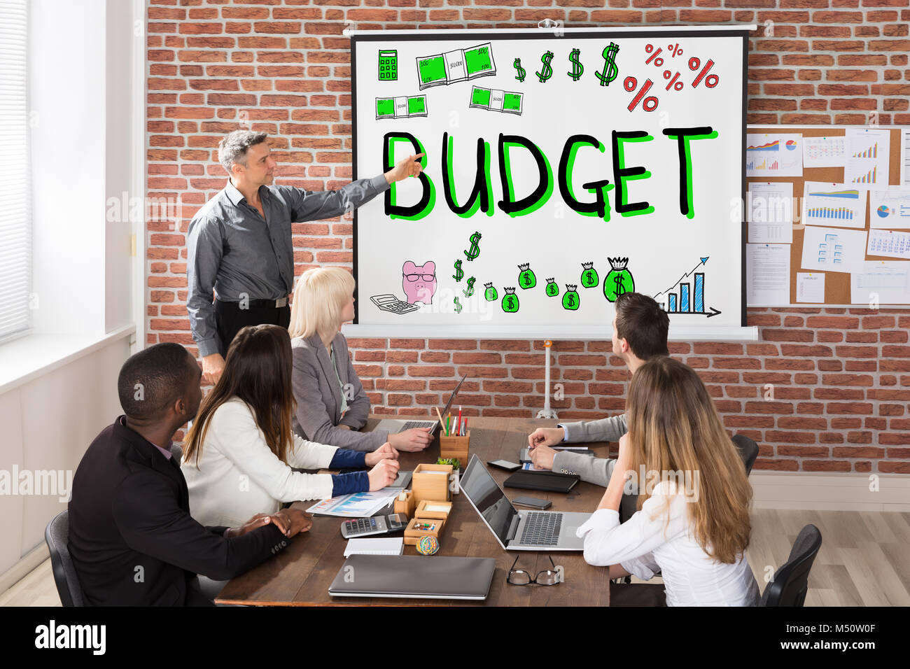 Group Of People At Budget And Finance Presentation Stock Photo - Alamy