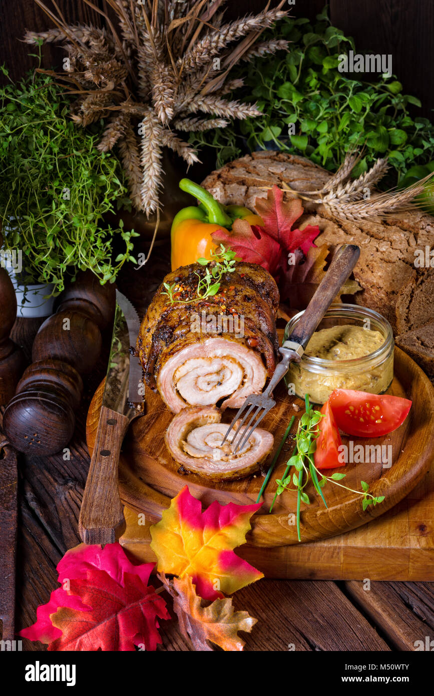 Rolling roasts fullly with dried fruit and bacon Stock Photo - Alamy