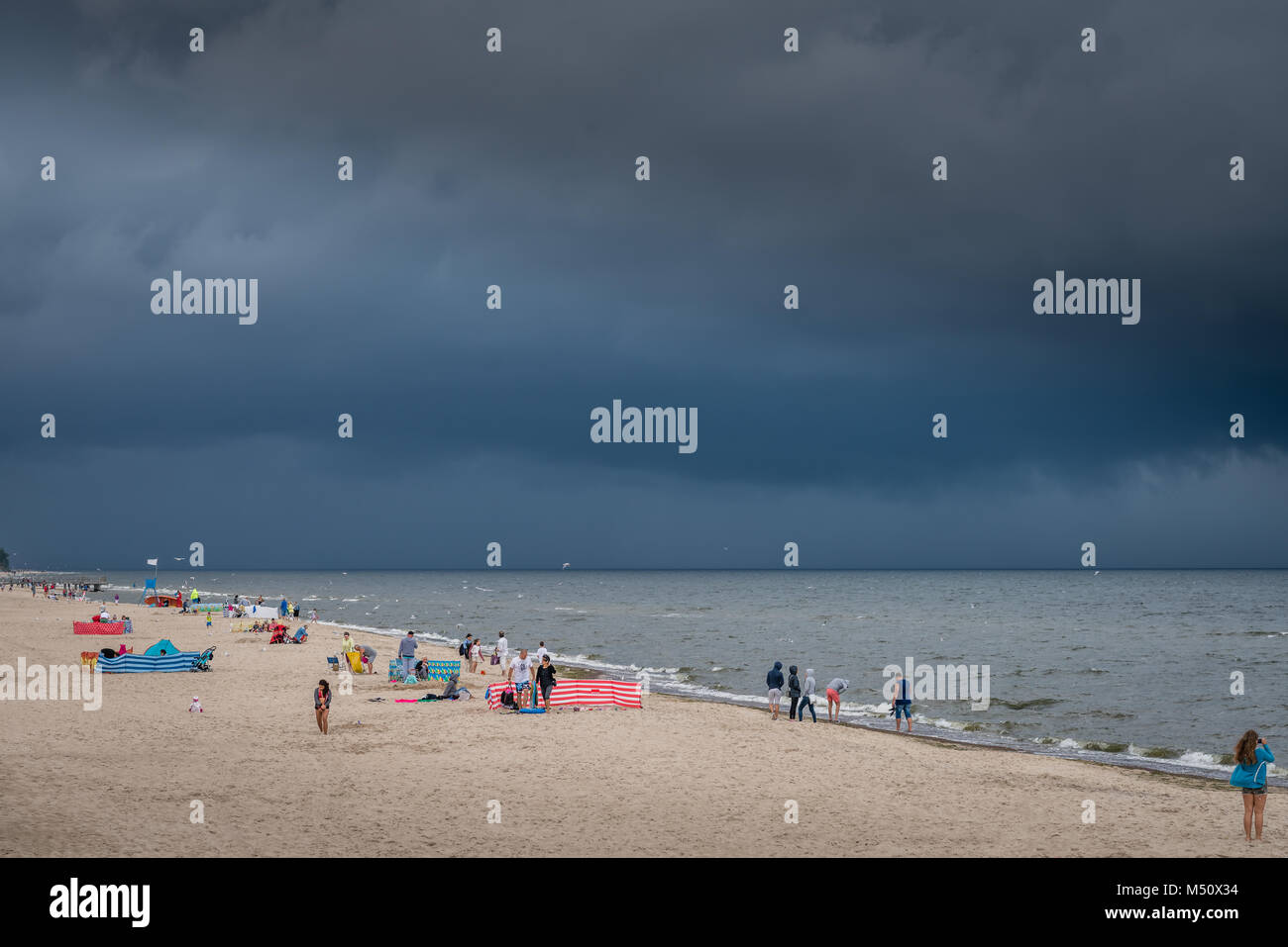 Sunbathers on a beach in Sarbinowo Stock Photo - Alamy
